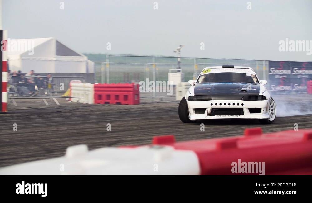 Close shot of a Nissan Skyline R32 drift car drifting fast into a ...