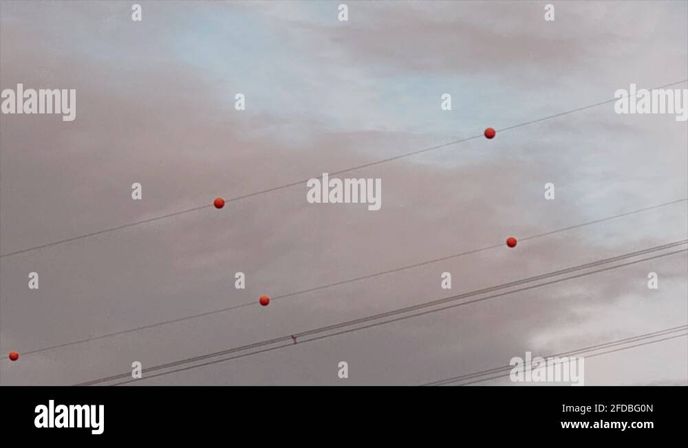 Moving under overhead electrical power lines with visibility markers ...