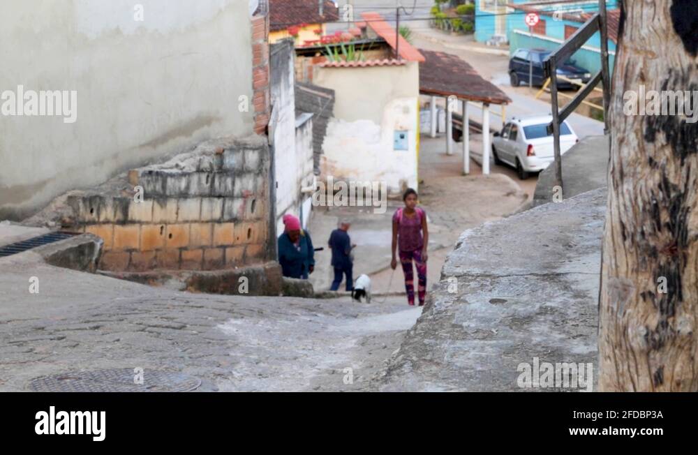 Girl walking her dog in a favela in Brazil Stock Video Footage - Alamy