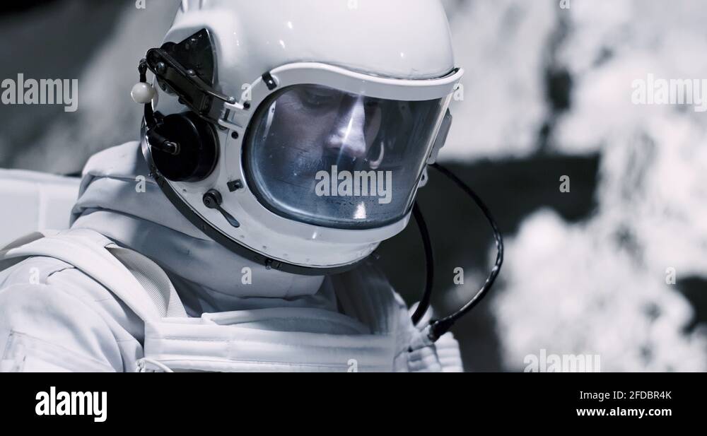 Close up of the male Caucasian NASA astronaut in the head armor looking ...
