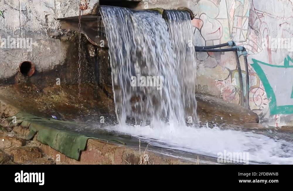 Sewer water drains from the pipe into the sea Stock Video Footage - Alamy