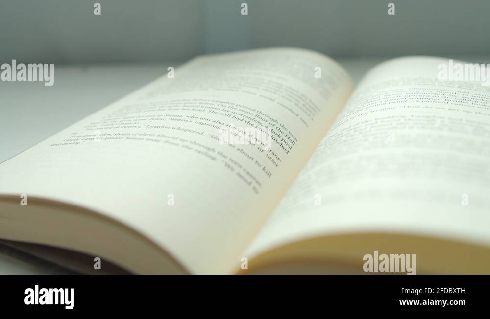 close up shot of finger flip a page of the book from left to right side ...