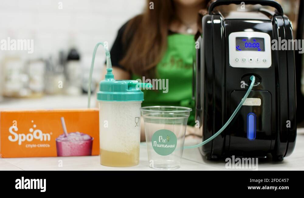 Oxygen cocktail made with oxygen enrichment machine, bubbling foam ...