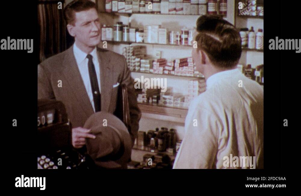 1950s: Drug store. Pharmacist introduces young man to salesman. Men ...