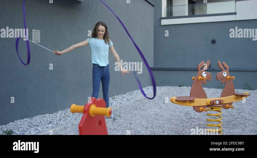 Adorable Little Girl Playing With Ribbon On Playground Stock Video ...