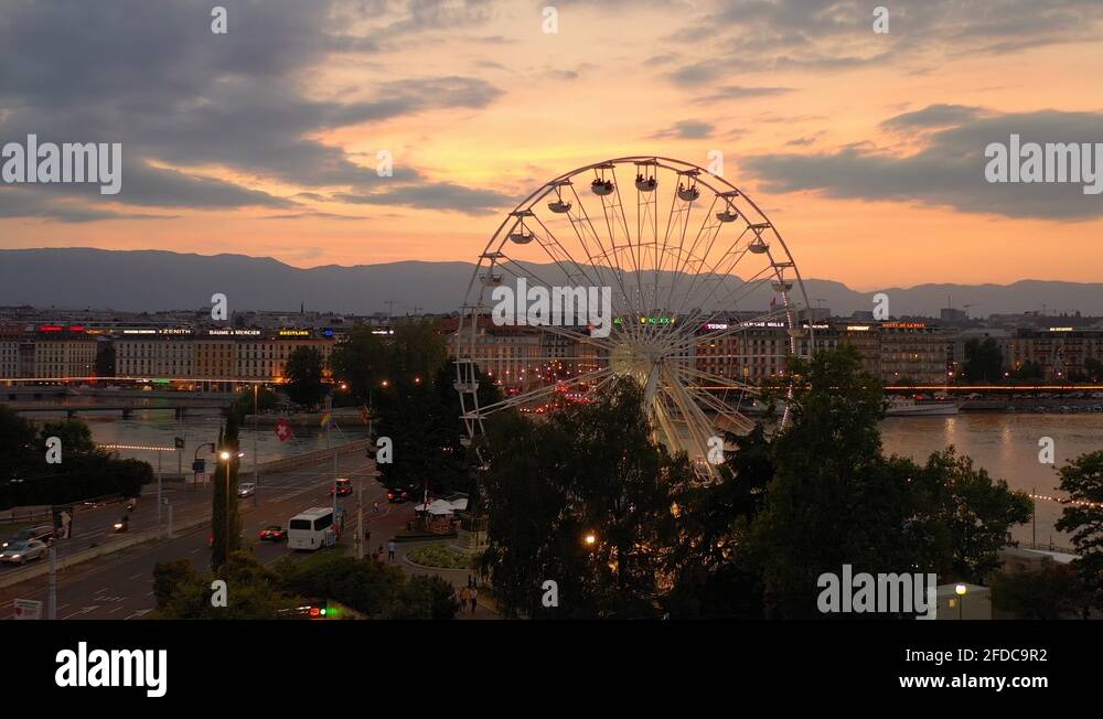 sunset illumination geneva traffic ferris wheel aerial panorama 4k ...