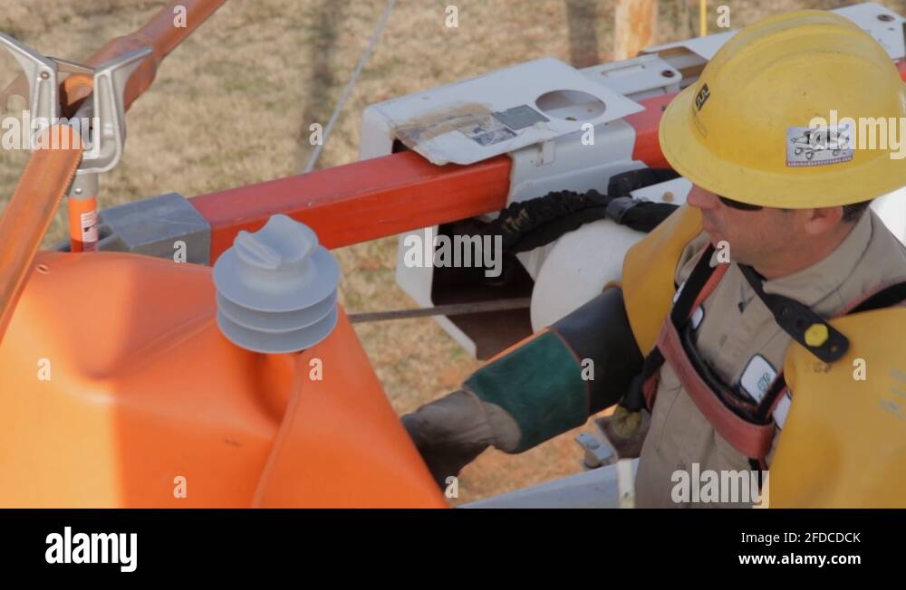 Electrical Lineman Working On Power lines on Utility Pole Stock Video ...