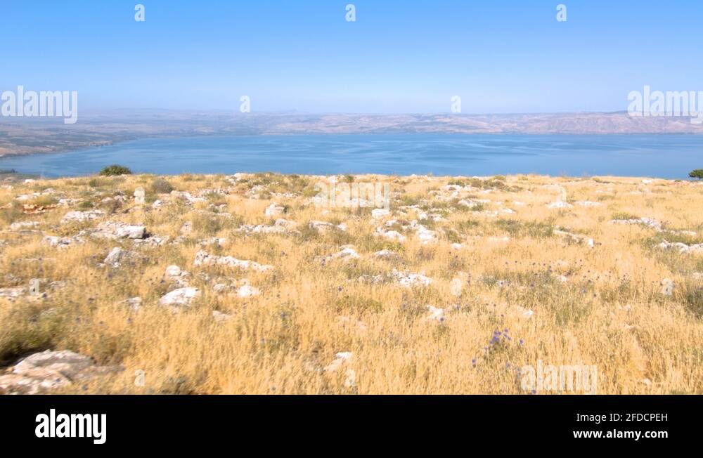 The beautiful blue Sea of Galilee from the rocky Arbel cliff mountain ...