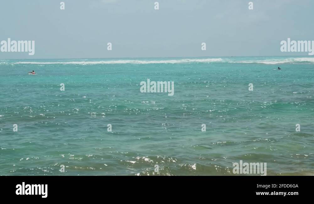 Surfers Swimming On The Deep Blue Sea Water At Diamond Beach In Hawaii ...