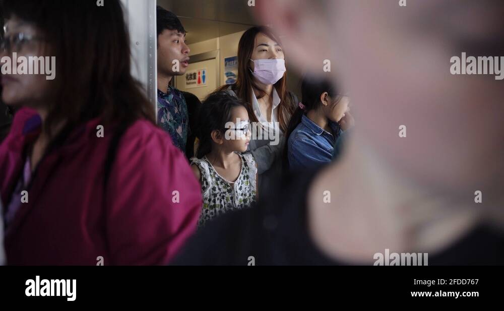 Female Asian train passenger wearing virus protection safety mask Stock ...