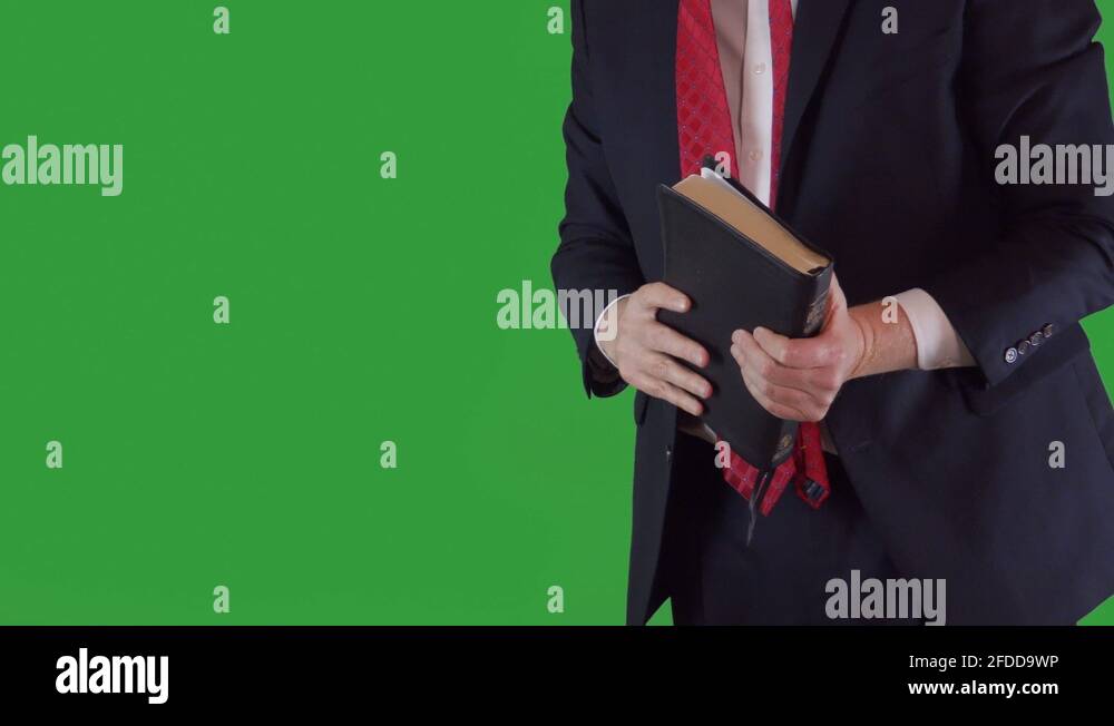 Green Screen of Pastor Holding Bible in hand Navy Blue Suit Stock Video ...