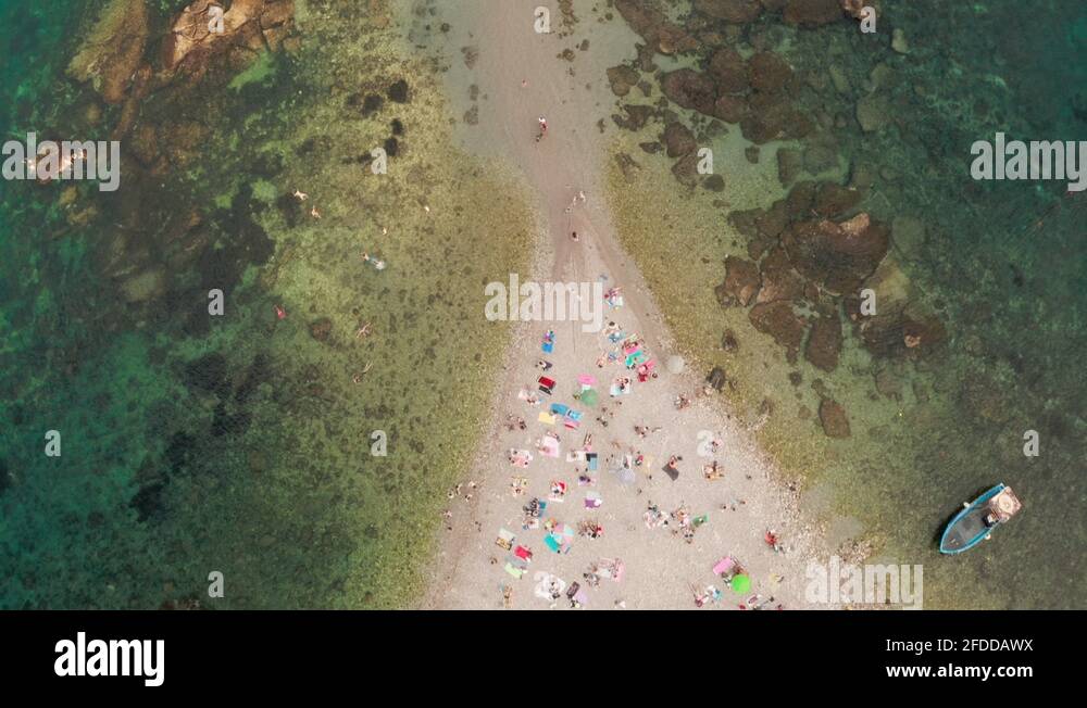 Top down aerial view of a sand bridge connecting two beaches ...