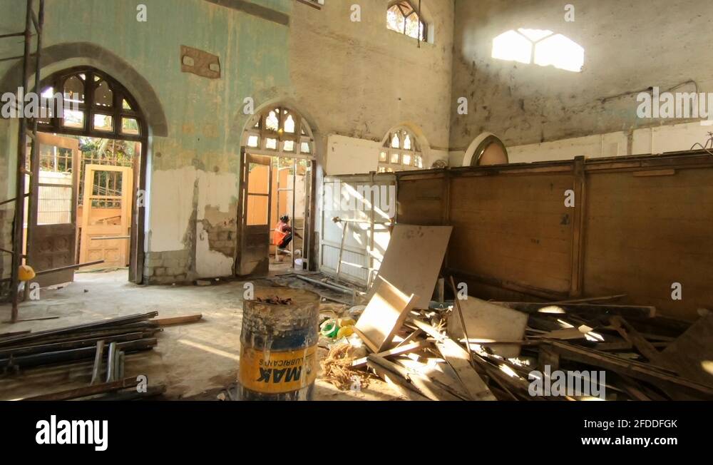 Restoration of the high ceiling vintage house after years, arc window ...