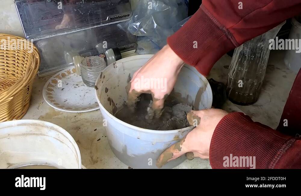 Hand in mud clay Stock Videos & Footage - HD and 4K Video Clips - Alamy