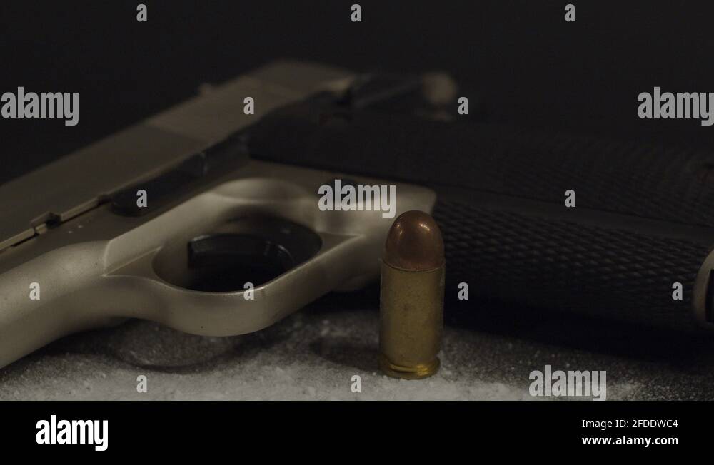 Dolly from bullet and pistol to pile of cocaine powder Stock Video ...