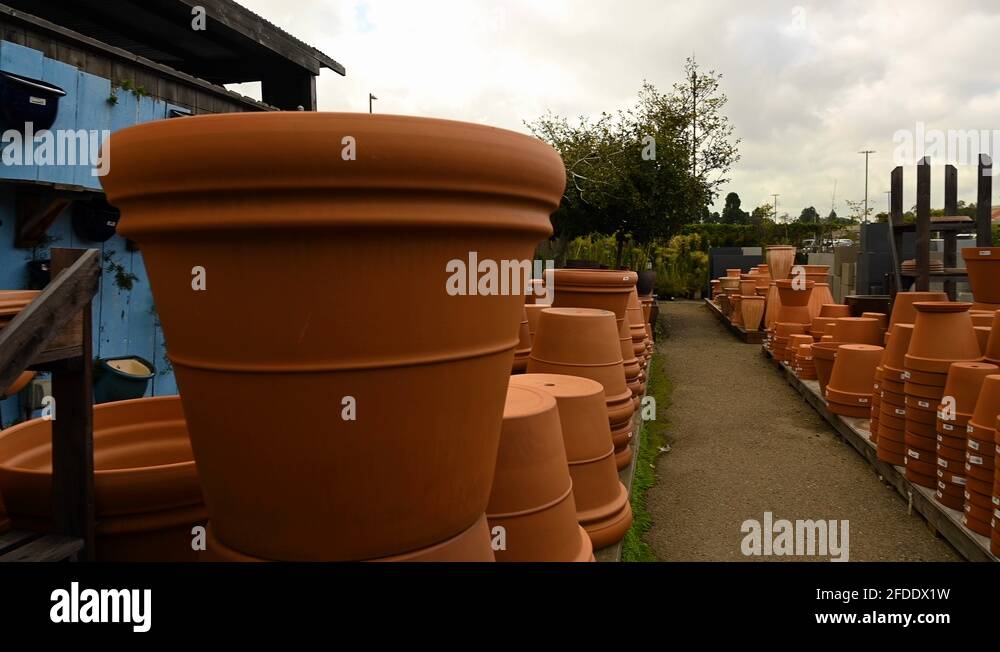 Pan of flower pots for sale at nursery. Pots for potted plants. Clay ...