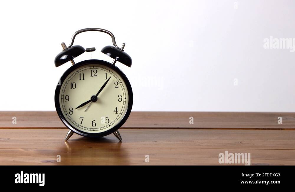 Time passing by on an old-fashioned clock at increased speed Stock ...