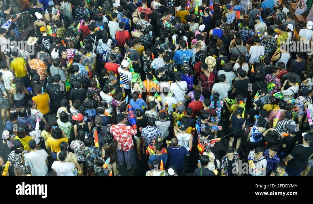 Crowd in water fight during Songkran Festival Stock Video Footage - Alamy