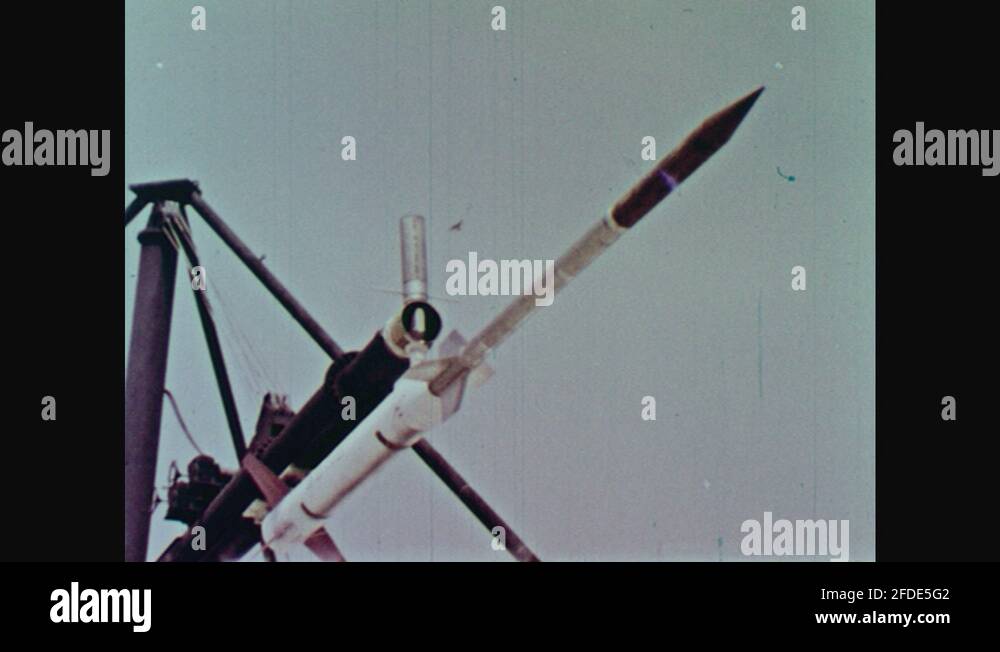 1960s: Rocket attached to arm on mechanism, raises up for launching ...