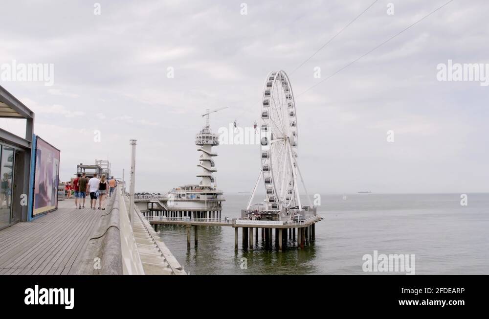 Man Flying Fox From The Top of Ferris Wheel Above The Sea Stock Video ...