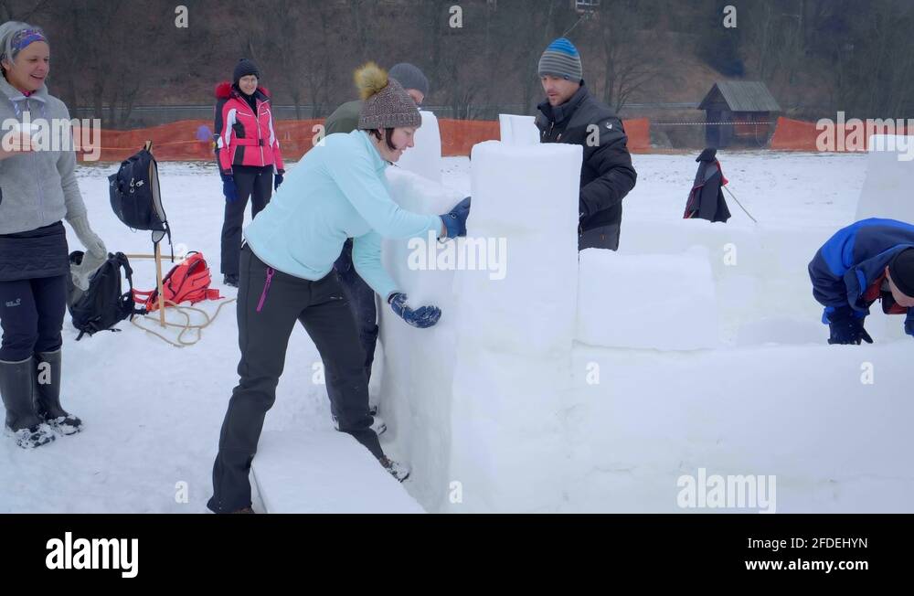 People building a castle with ice bricks while competing at Castles of ...
