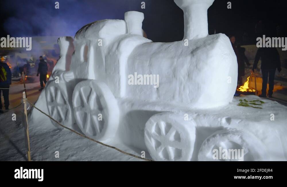 Handmade big snow train sculpture. Slowly zoom in to the wheel of the ...