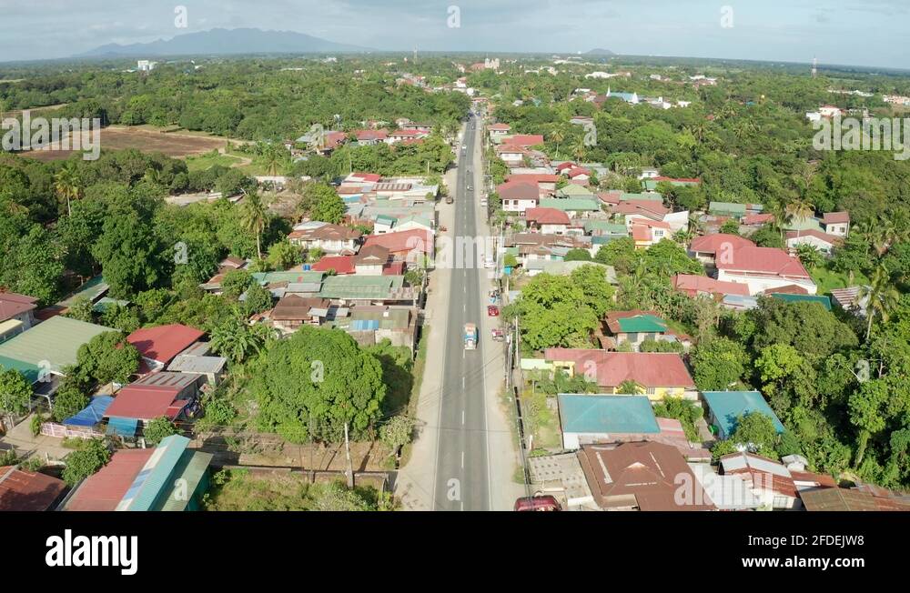 Descending Aerial of Road and Tropical Houses in Batangas, Philippines ...