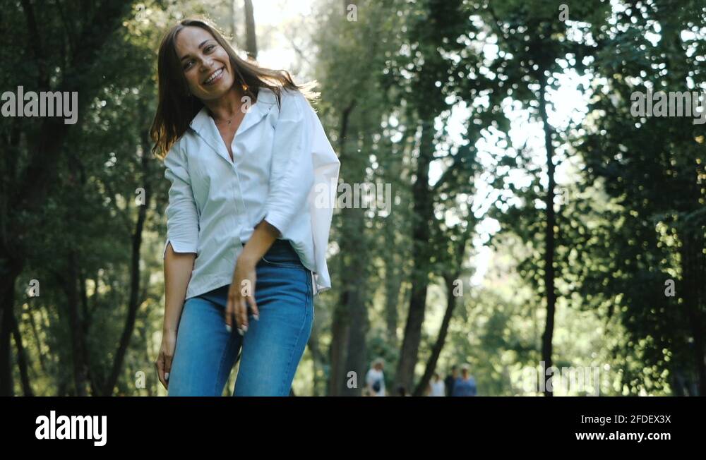 Spring Photo Shoot For A Cute Girl In White Shirt And Jeans Cheerful Young Stock Video Footage
