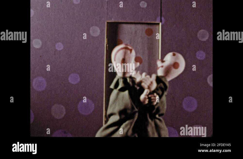 1960s: Two hand puppets hug then dance around together Stock Video ...