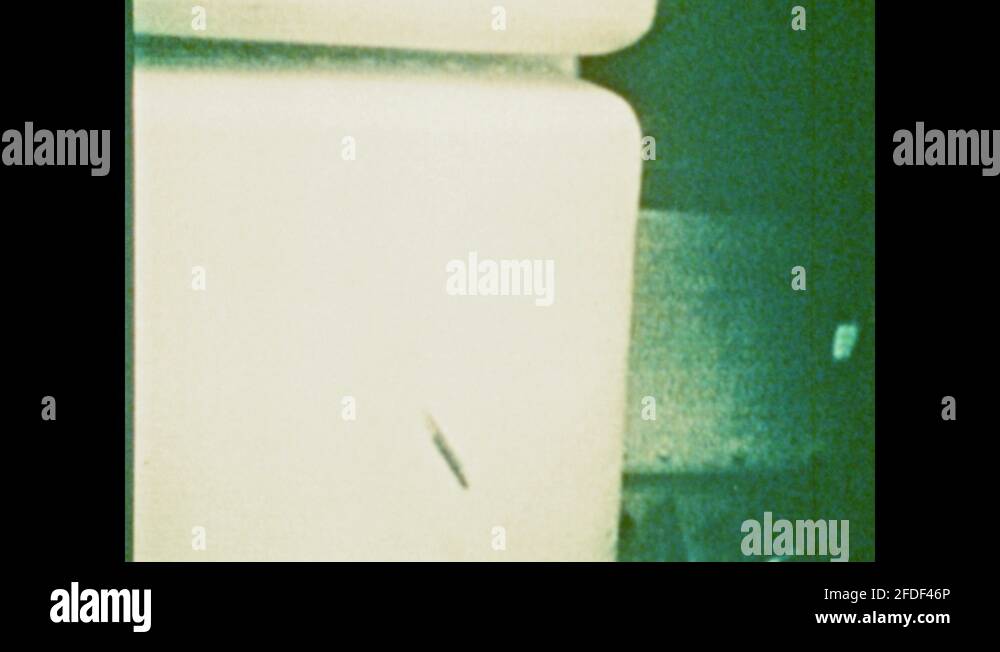 1970s: Small, flat rectangle object floats in zero gravity on Skylab ...