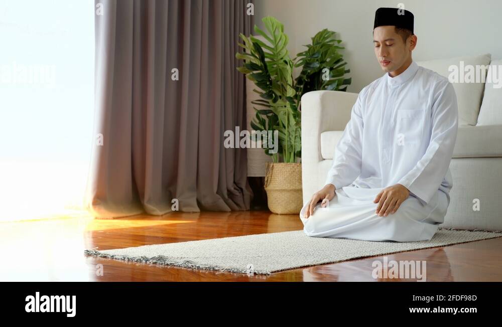 Portrait of Asian Muslim man reciting surah al-Fatiha passage of the ...