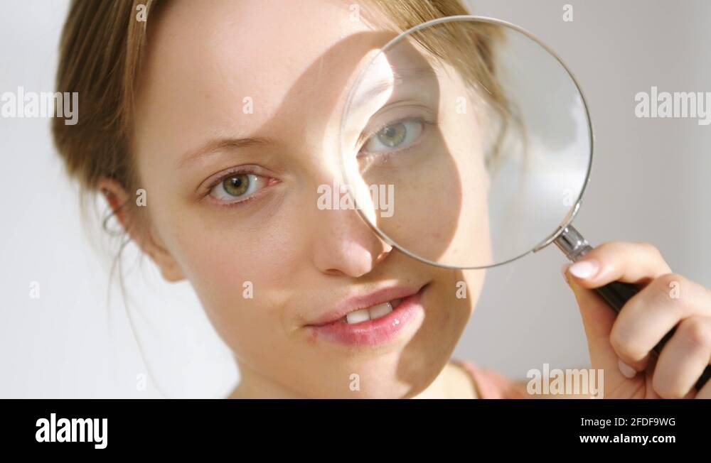 Woman placing magnifying glass Stock Videos & Footage - HD and 4K Video ...