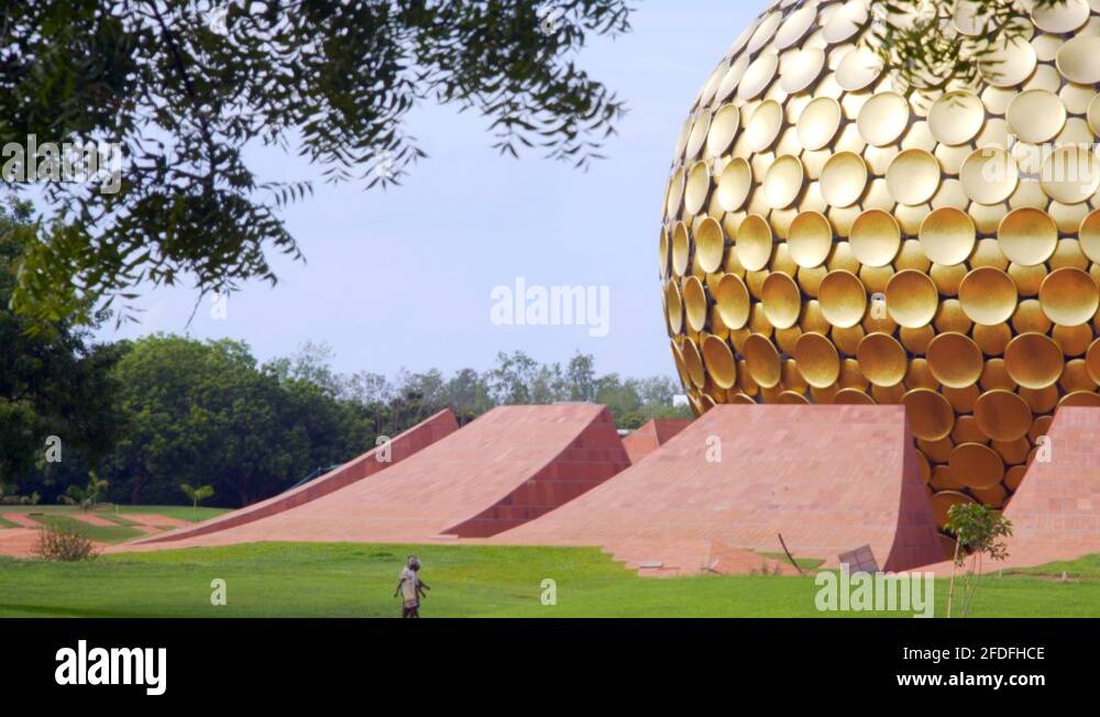 People walk to Matrimandir Temple of the Mother, Auroville spiritual ...