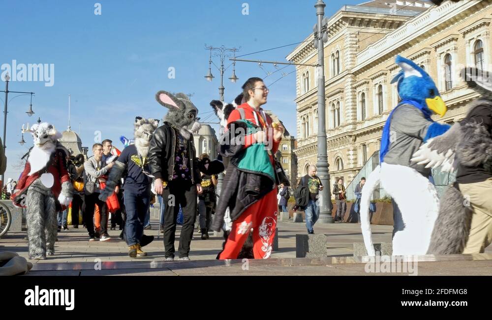 People dressed as in an animal costume called as furry walking on the ...