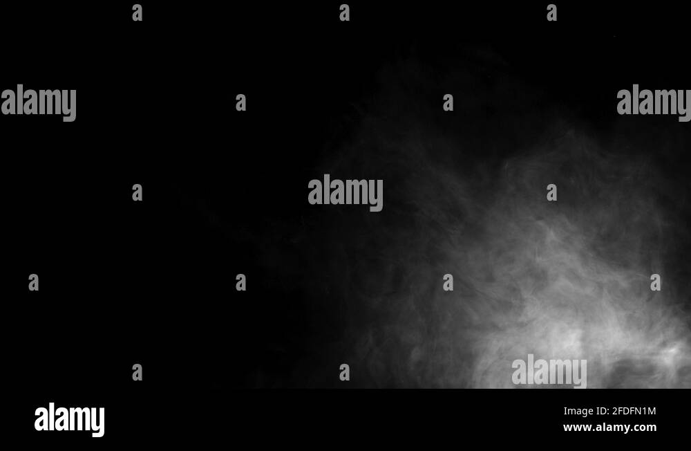 Atmospheric smoke, fog, haze effect in slow motion on black background ...