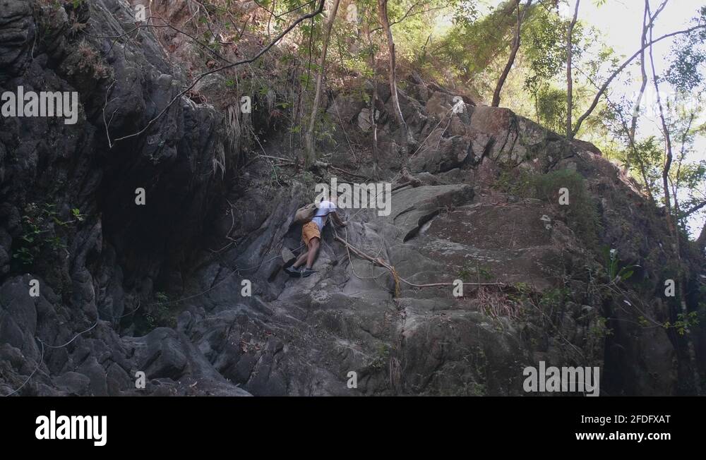 Young man rope climbing rocky Stock Videos & Footage - HD and 4K Video ...