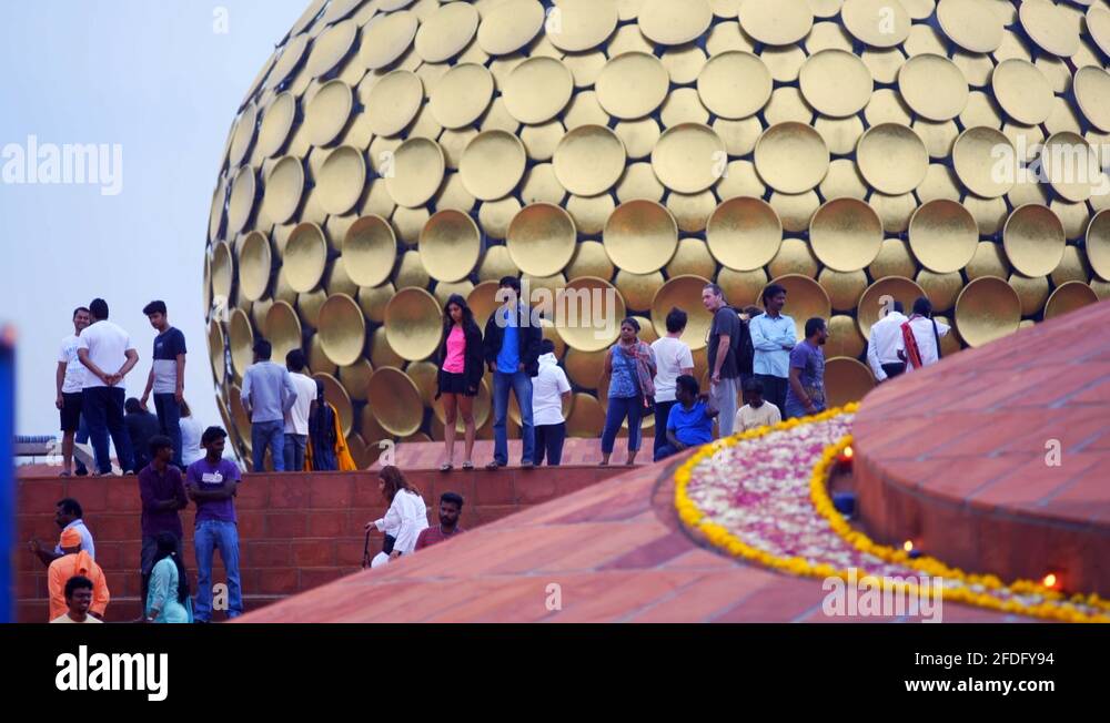 Many people at Matrimandir temple of Mother amphitheater, Auroville ...