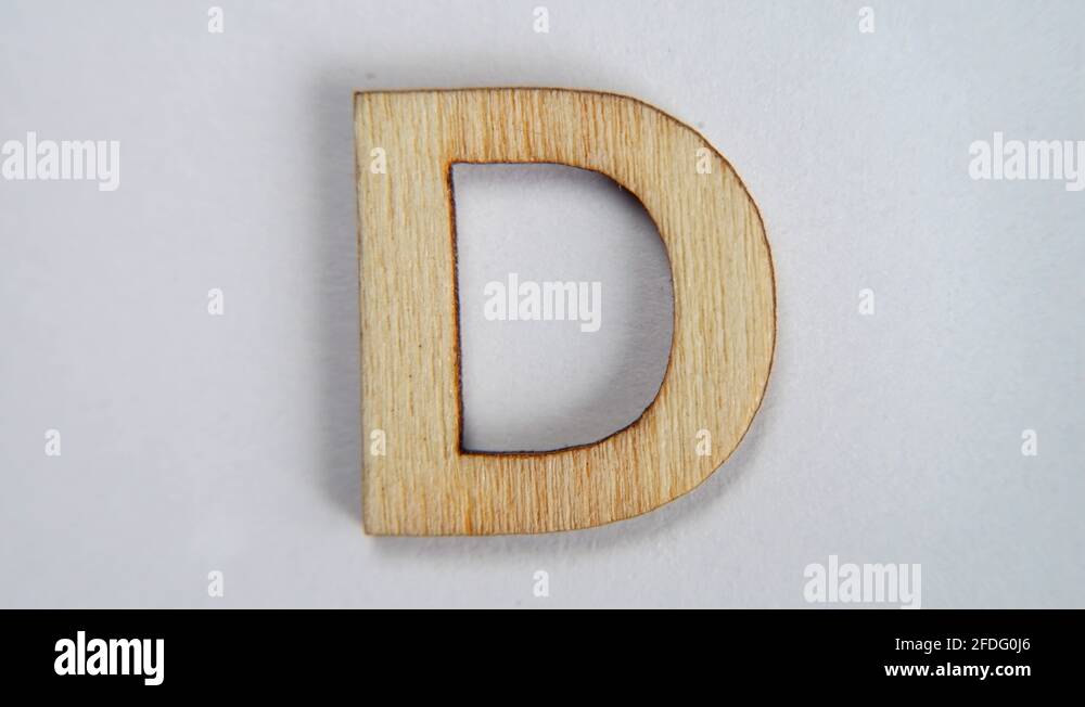 Dancing letter D of the English alphabet in motion on a white ...