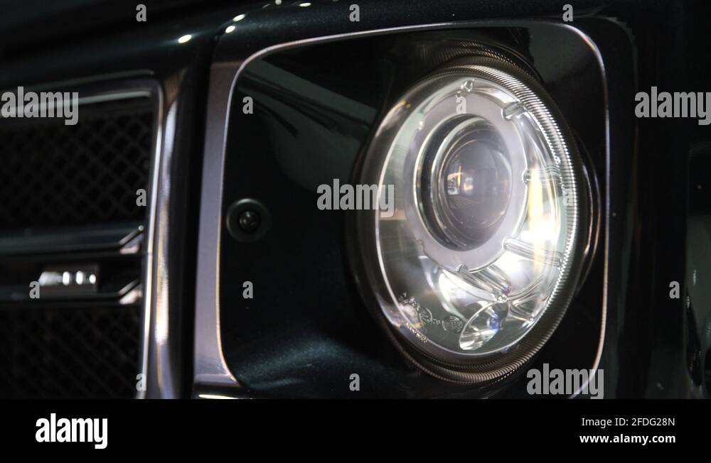 Headlight on a Mercedes Benz G Class AMG SUV. Sliding Shot Stock Video ...