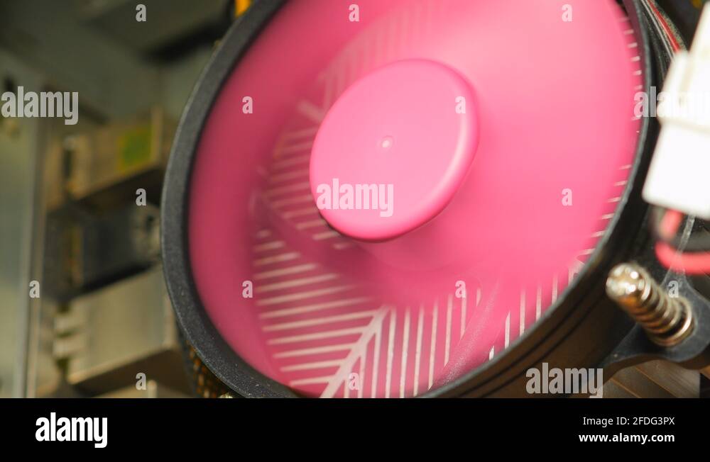 The Pink Processor Cooler On The Motherboard Is Spinning In Computer ...