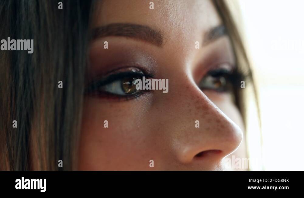 Pretty girl face opening and closing eyes. Pensive young woman thinking ...