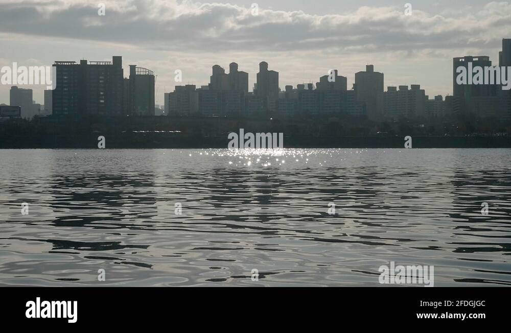 Water running down the Han River in Seoul, South Korea. High rises in ...