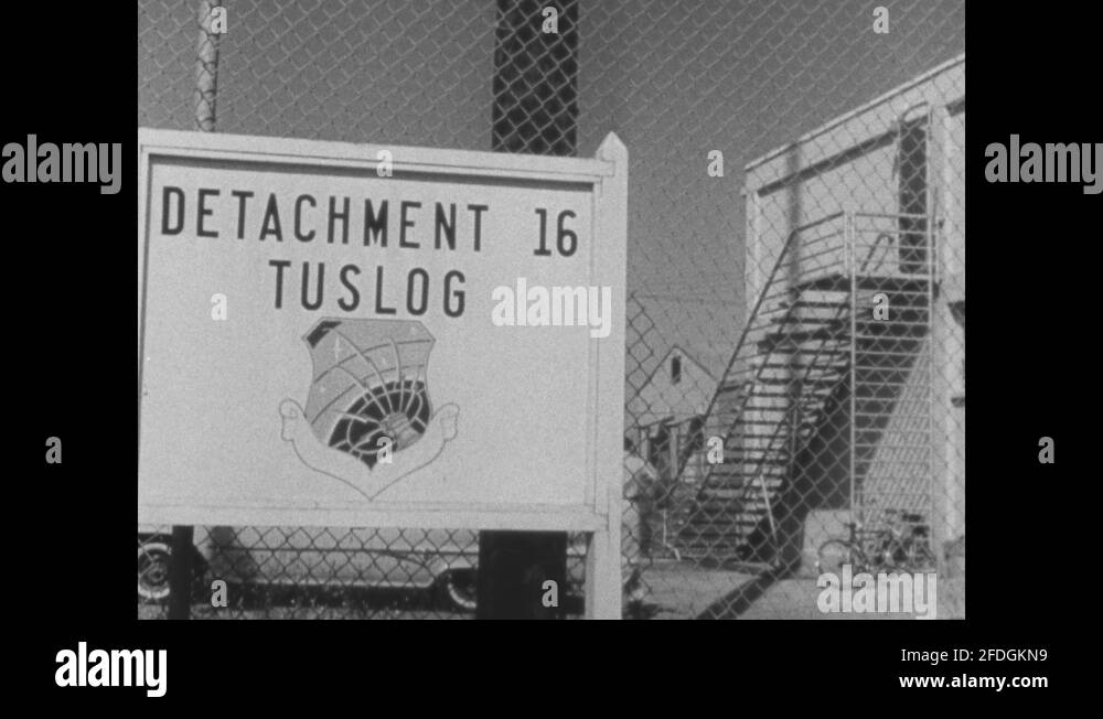 1960s: sign: "Detachment 16 Tuslog", soldier runs up stairs, 2 soldiers ...