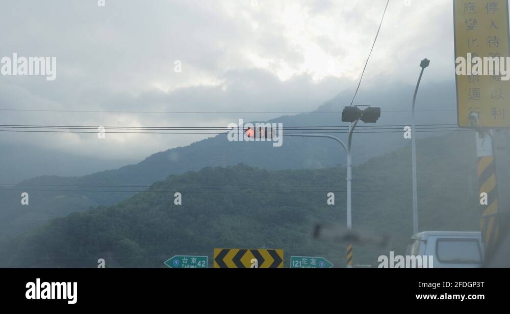 Illuminated traffic signal digital countdown stop sign and misty Taiwan ...
