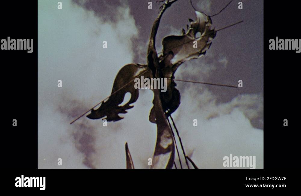 1960s: Tilt down statue, man and woman talking under statue Stock Video ...