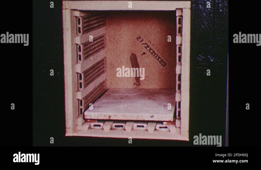 1950s: Shelf appears in kiln. Man loads pottery. Man stacks pottery and ...