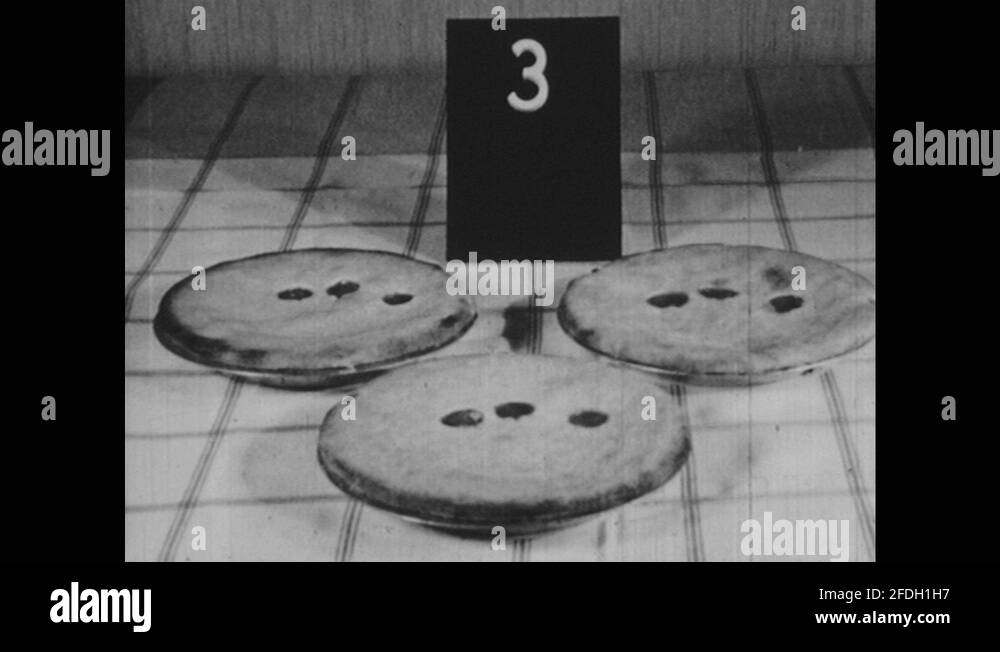 1960s: Three pie dishes each contain half a pie. Three plates each ...