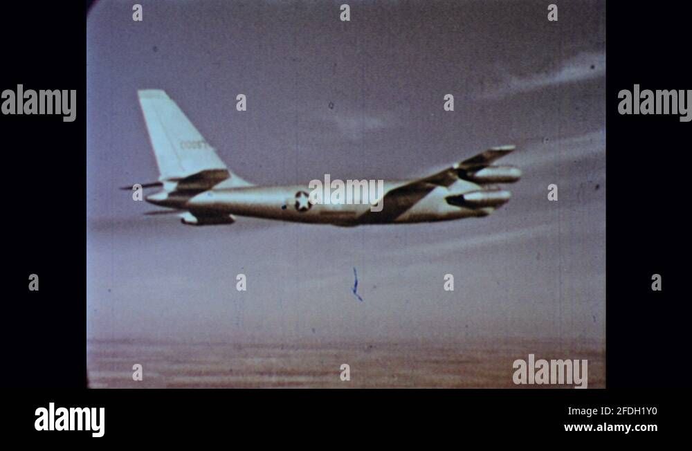 1960s: US Airforce airplane flies. Pilot checks instruments on plane ...