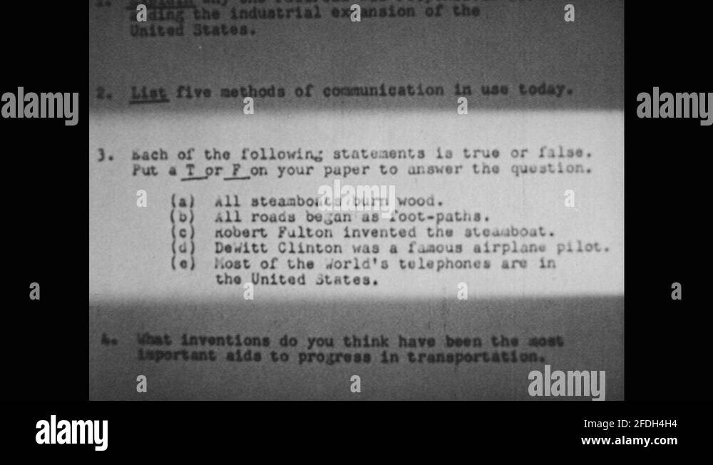 1950s: Highlighted section of test. Boy takes test at desk in classroom ...