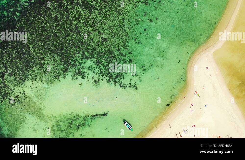 Beautiful sea texture with coral reefs and rocks under crystal emerald ...